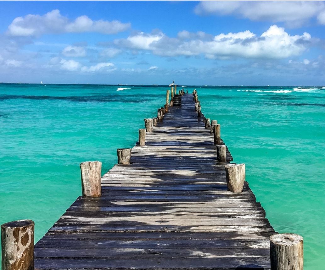cancun boardwalk into ocean - Travel Off Path