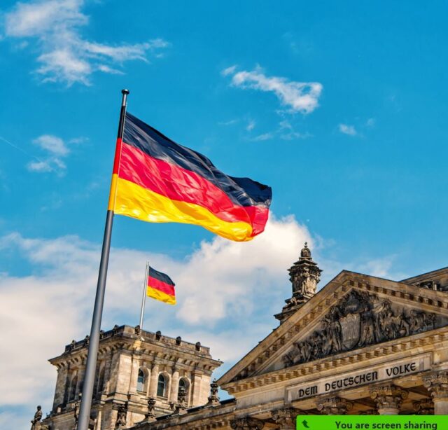 German-Flag-outside-building - Travel Off Path
