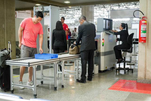 Passengers Going Through Airport Security Screening - Travel Off Path