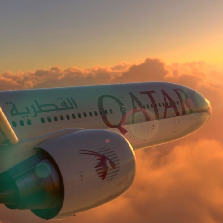 Qatar airlines airplane in flying in sunset - Travel Off Path