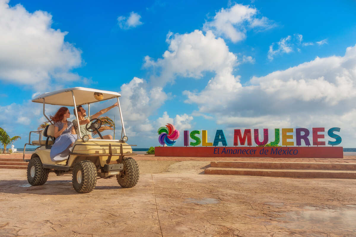 Tourists Driving A Tourist Car In Isla Mujeres, Quintana Roo, Mexico ...