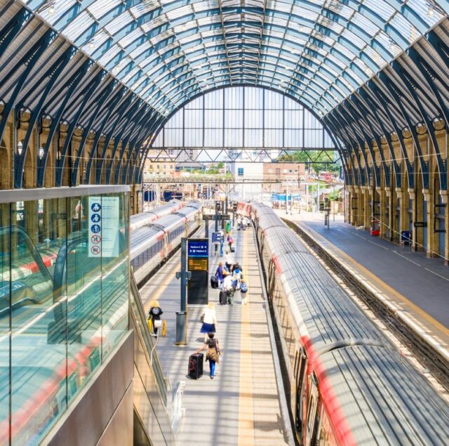 London England Train station with people walking - Travel Off Path