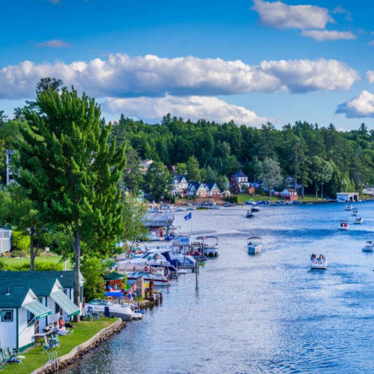 View of boats in Paugus Bay, in Weirs Beach, Laconia, New Hampshire ...