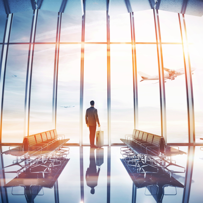 man-watching-plane-take-off-at-airport - Travel Off Path