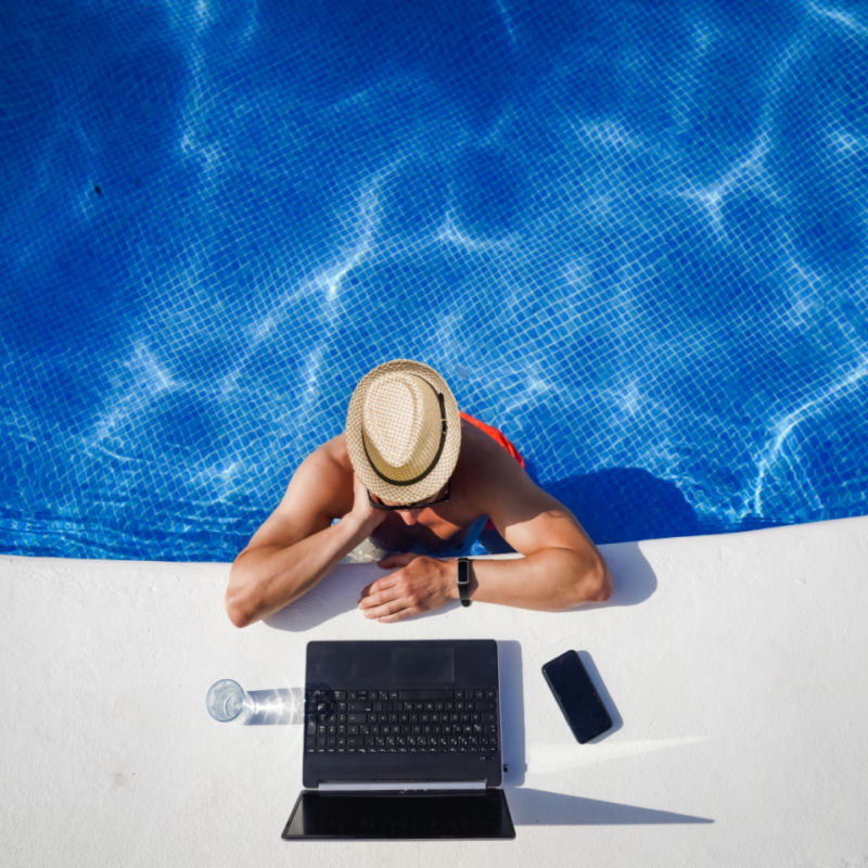 bird view of remote online working digital nomad man on workation with ...
