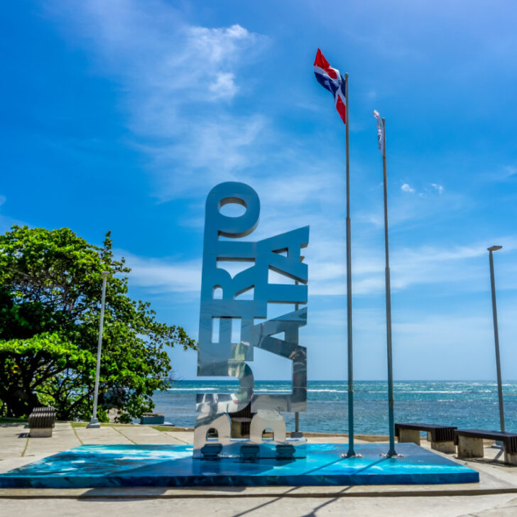 puerto-plata-sign-and-dominican-flag - Travel Off Path