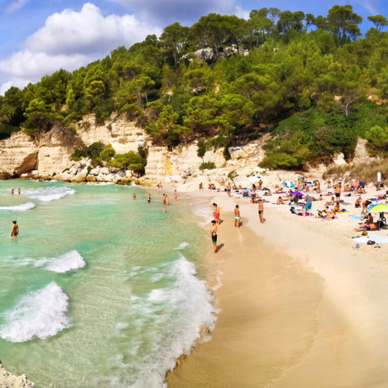 tourists-at-menorca-beach - Travel Off Path