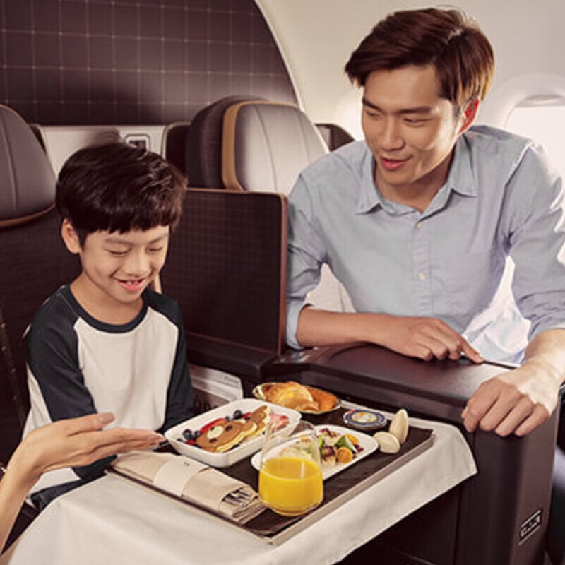 Passengers Enjoying A Meal During A STARLUX Flight - Travel Off Path