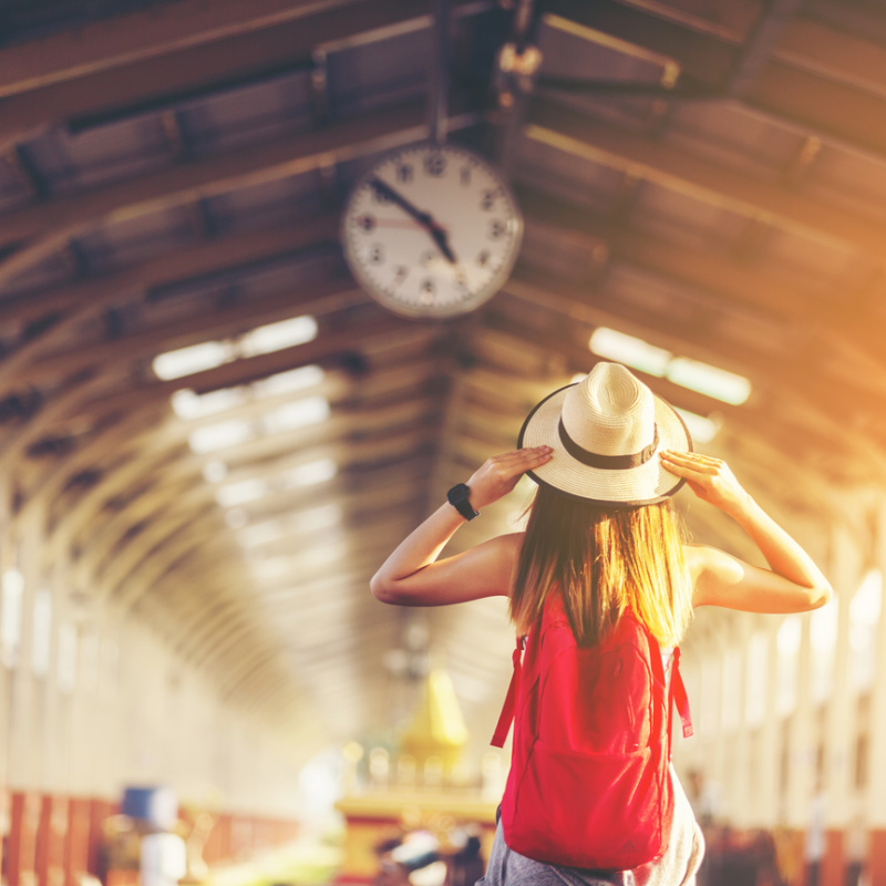 Tourist-waiting-to-board-train - Travel Off Path