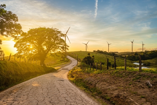 Beautiful,Landscape,Of,A,Road,With,Wind,Towers,And,A - Travel Off Path